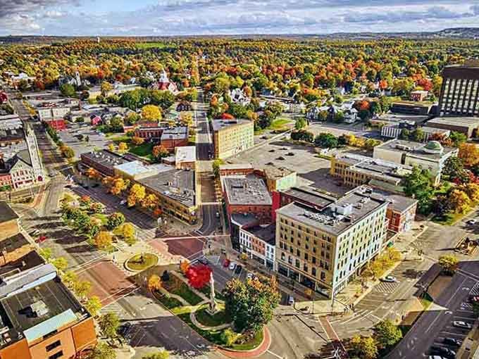 Autumn colors paint the landscape in brilliant reds and golds, turning this bird's-eye view into a living postcard worth framing.