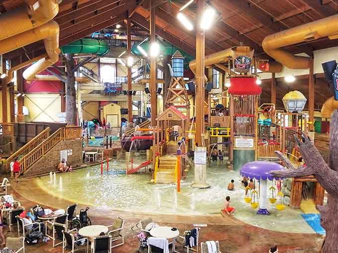 The multi-level play structure towers over shallow waters, keeping little ones entertained for hours on end safely.