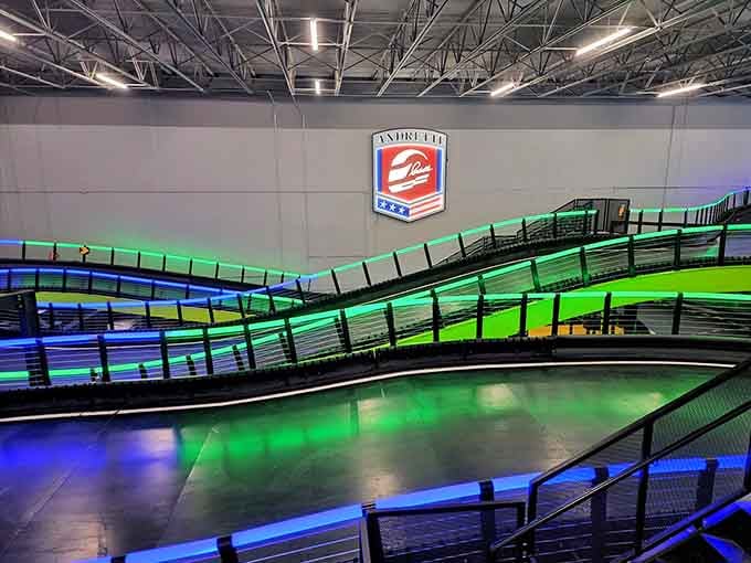 Those glowing green and blue track levels create an atmosphere that feels futuristic and thrilling all at once.