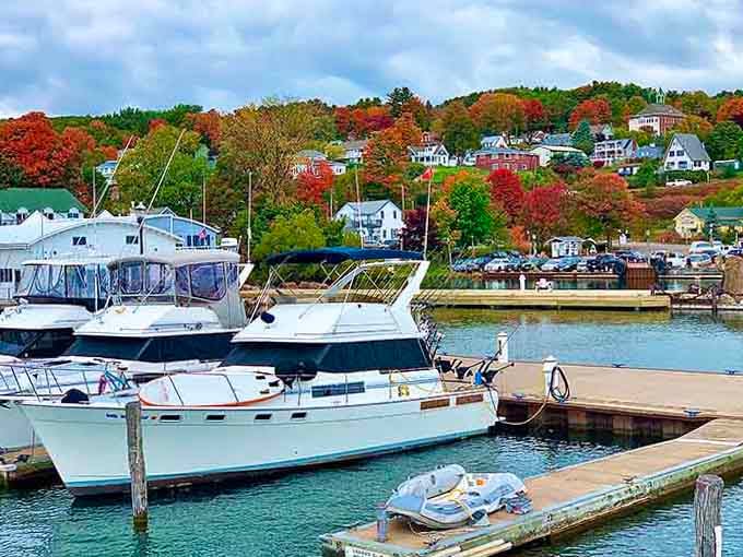 The marina sparkles with boats bobbing gently while fall colors paint the hillside like nature's showing off for the tourists.