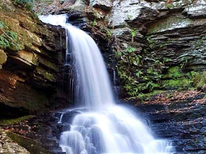 This single cascade flows smooth as silk over layered stone, a hidden gem tucked in Pennsylvania's wild heart.