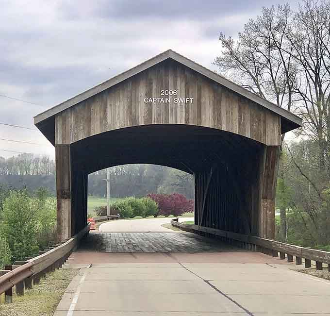 That brick-paved approach and arched entrance give this bridge serious character that modern construction just can't replicate.