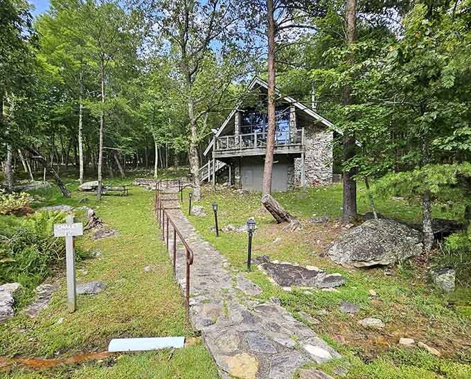 Stone pathways lead to a rustic chapel nestled among the trees, where nature provides the most beautiful stained glass windows.