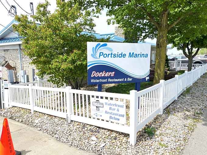 That crisp white picket fence and marina sign mark your gateway to island dining where boats and fresh catches meet.