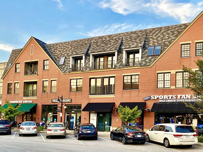 Mixed-use buildings line the street with Starbucks below and apartments above, blending daily conveniences with residential comfort perfectly.