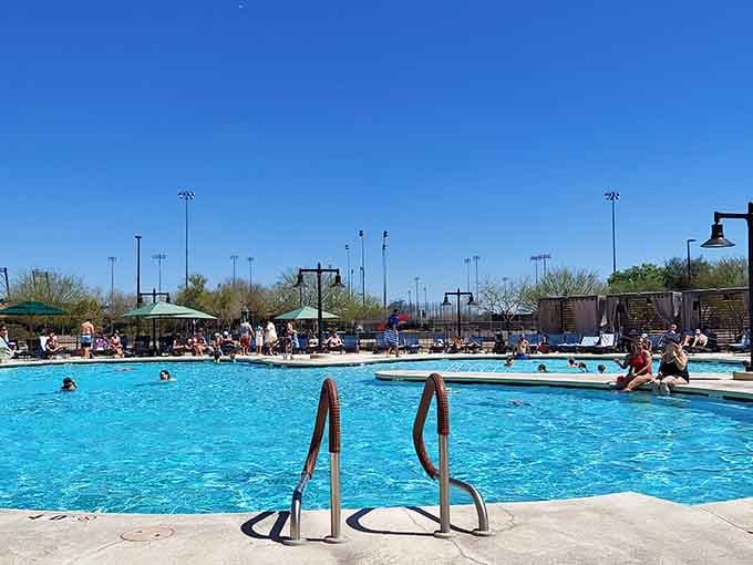 The sparkling pool stretches out under perfect blue skies, offering simple pleasures that never go out of style.