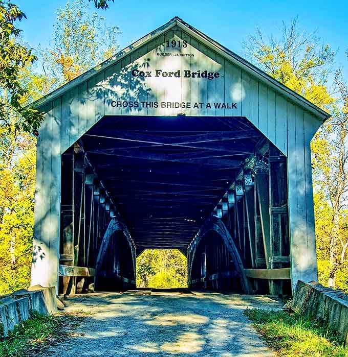 The blue-gray paint makes this bridge the cool kid in the covered bridge family, standing out beautifully.