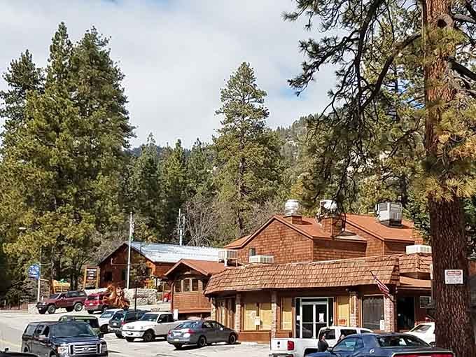 Rustic cabins with terracotta roofs blend into the forest, creating a storybook setting that feels miles from ordinary life.