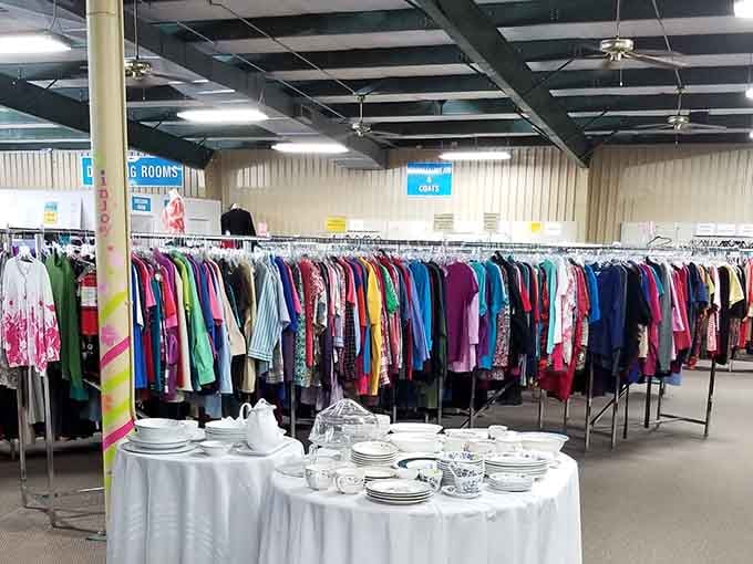 Endless clothing racks stretch toward the horizon like a rainbow of second chances and budget-friendly fashion possibilities.