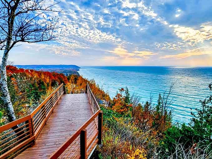 This boardwalk leads you through fall's fiery display straight to where sky kisses water in perfect harmony.