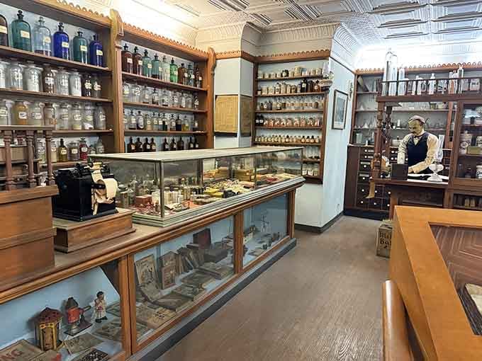 Vintage apothecary bottles line wooden shelves like a pharmacist's time capsule from another century.