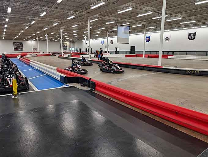 Clean lines and bright lighting create a modern motorsports cathedral where speed worship happens seven days a week.