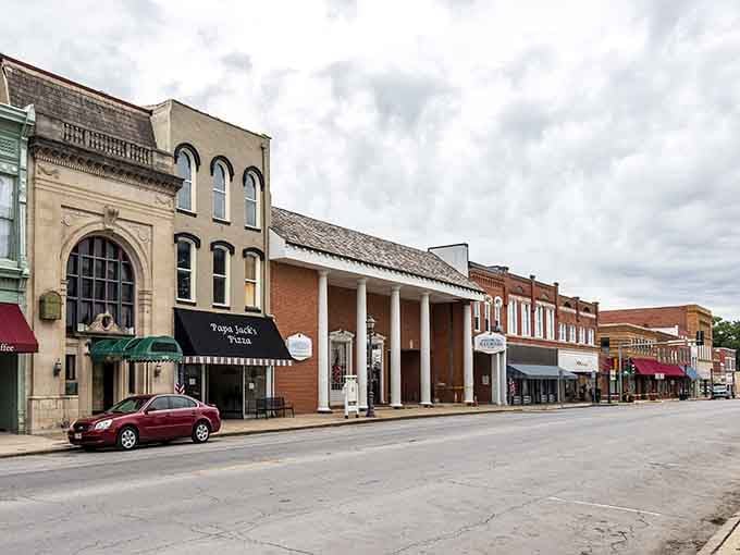 Classic columns and vintage awnings create an architectural harmony that modern buildings just can't replicate.