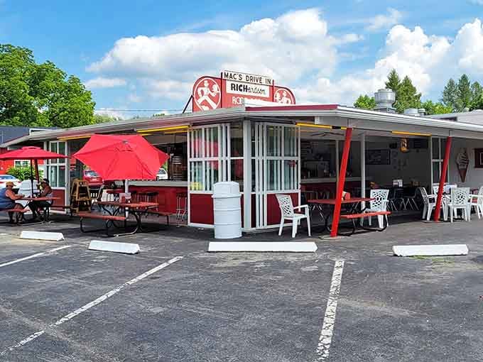 Red umbrellas and picnic tables create the kind of outdoor dining experience that makes you forget your troubles completely.