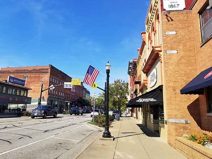 American flags wave proudly along streets where history isn't just preserved, it's still being lived daily.