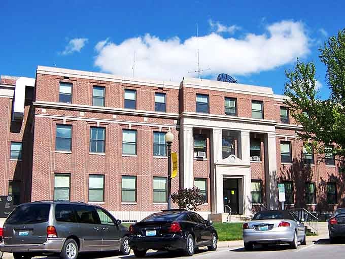 Bright blue skies frame this handsome civic building, proving small-town architecture can hold its own against any big city.