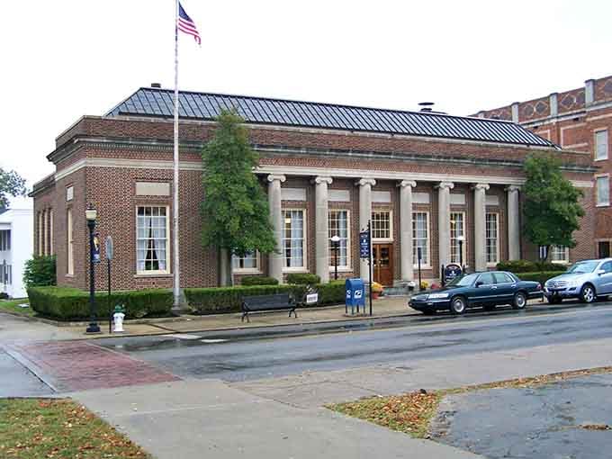 That stately columned building stands proud like the town's favorite grandfather watching over Main Street with quiet dignity.