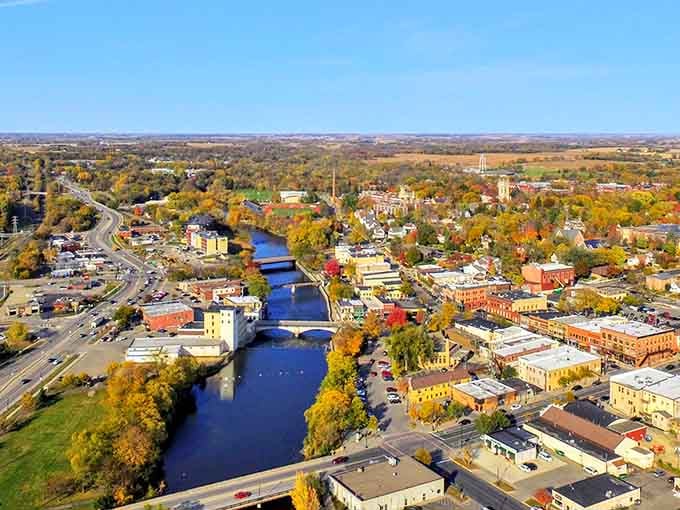 Autumn colors paint the riverside town in shades that would make even Bob Ross reach for extra brushes.