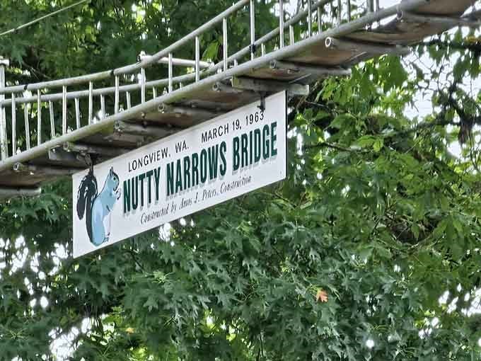 The dedication plaque reveals a 1963 construction date, making this adorable squirrel highway a genuine piece of thoughtful local history.