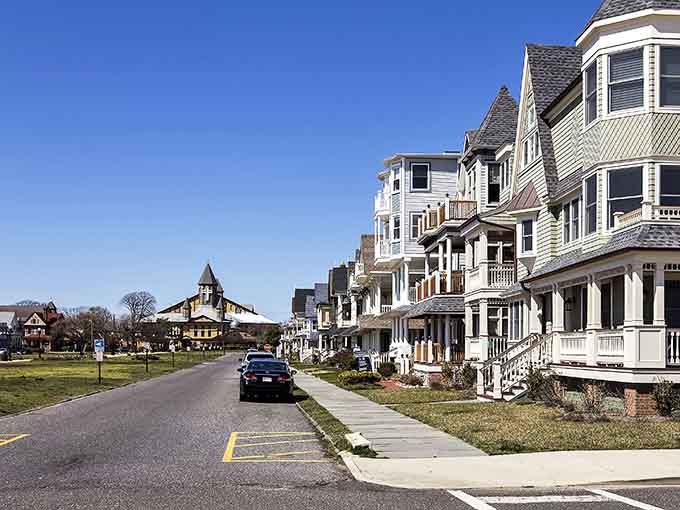 Grand Victorian homes with wraparound porches face the street like elegant sentries guarding seaside summer memories.