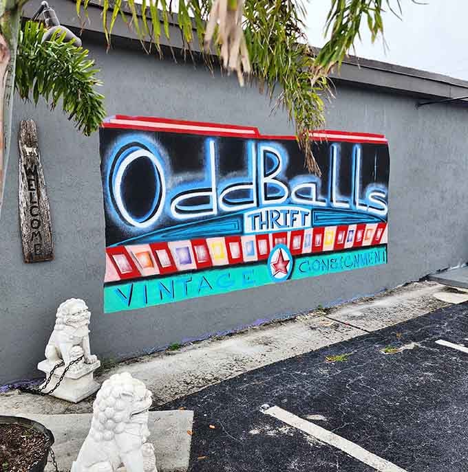 The retro neon-style mural and guardian lion statues announce this isn't your average thrift store&mdash;it's a curated experience.
