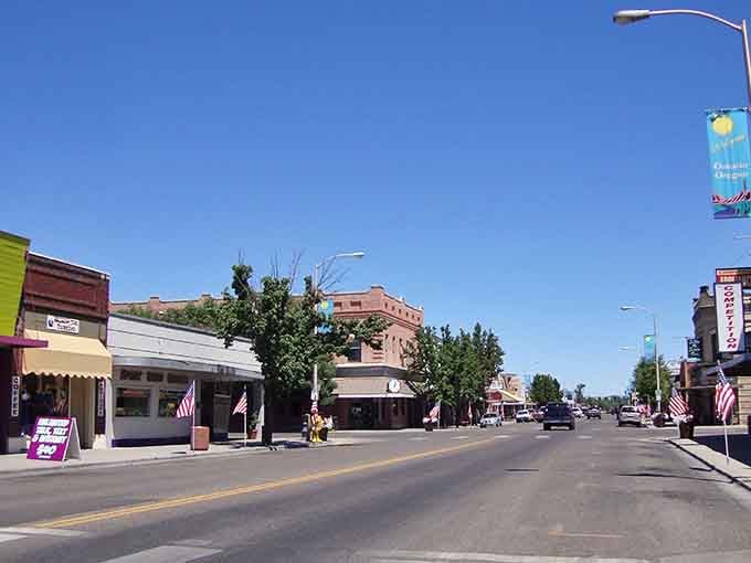 Patriotic banners wave along Main Street where community pride costs nothing but means everything to the folks here.