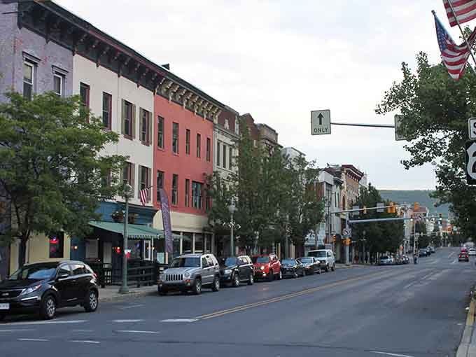 Downtown Pottsville showcases beautiful historic architecture and local businesses, where American flags wave proudly above streets filled with character and community spirit.