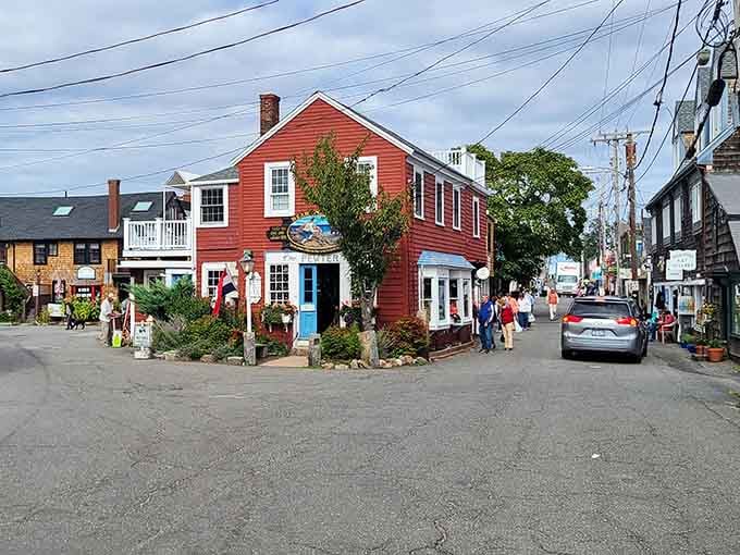 Bright red buildings pop against the harbor like a cheerful greeting card that somehow came to life.