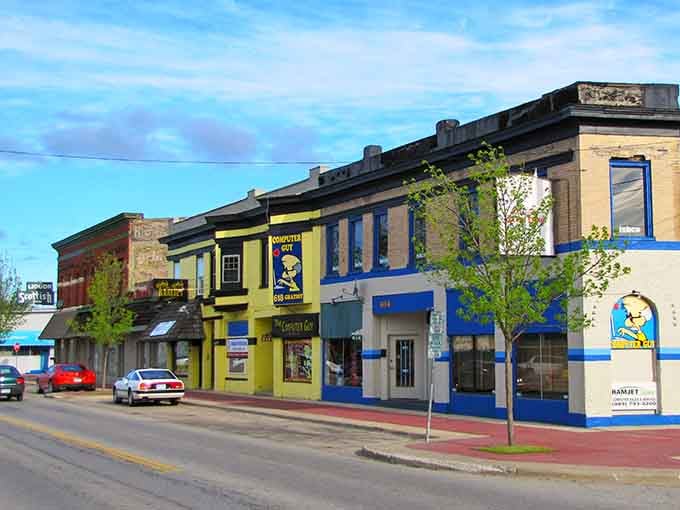 Those bold yellow and blue storefronts pop against the classic architecture like a cheerful reminder to enjoy life.