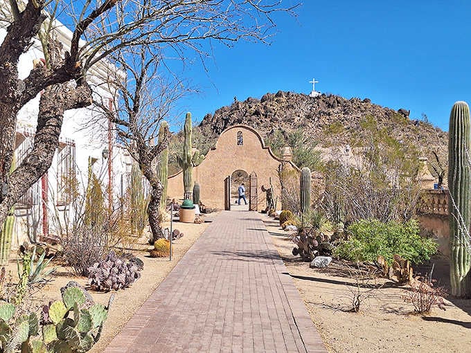 Framed by mountains and mesquite, this historic church entrance welcomes visitors through centuries of Southwestern heritage and beauty.