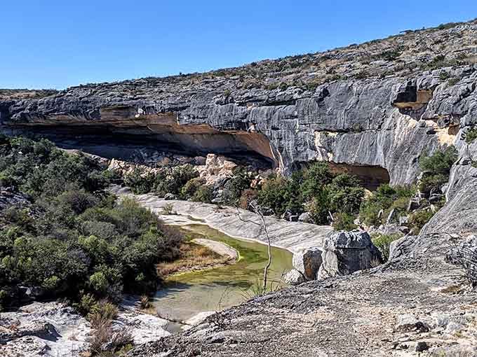 Limestone cliffs standing guard over the canyon like nature's own cathedral, weathered and magnificent beyond words.