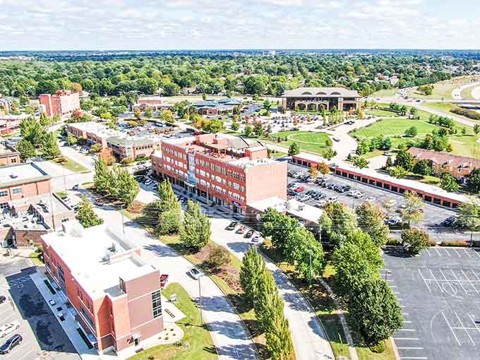 From above, the red brick buildings and green spaces create a patchwork quilt of urban planning done right.