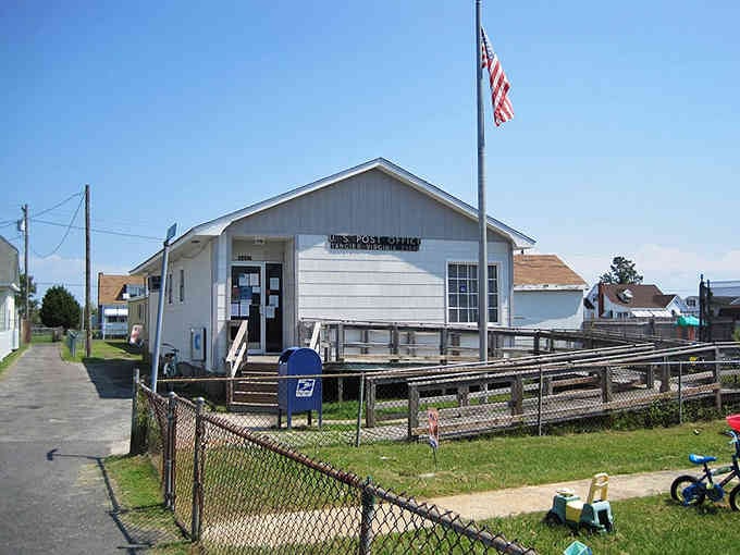 The post office stands proud with Old Glory flying, serving an island community that knows everyone's name.