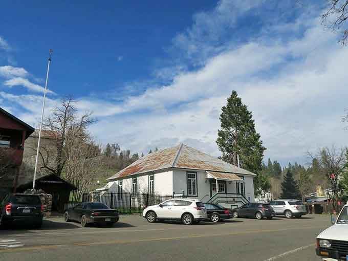 Volcano's octagonal building sits quietly under pines, a peaceful reminder of California's colorful mining past and present charm.