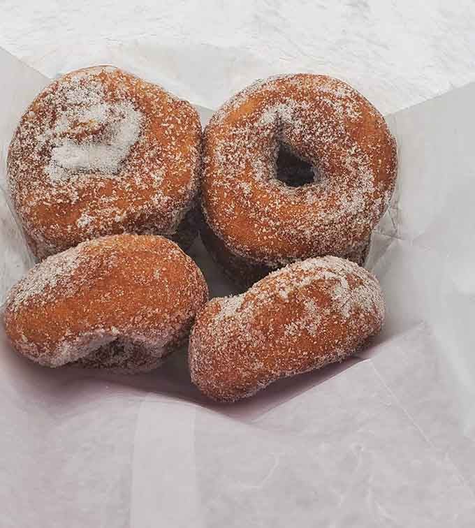 Cinnamon sugar donuts so generously coated they look like they've been rolling around in sweet, spiced snow all morning long.