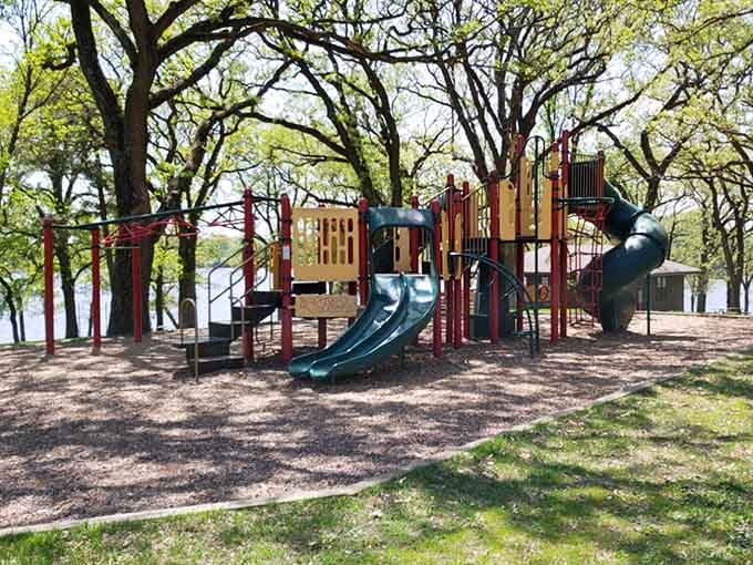 Playgrounds by the lake mean kids can actually play outside instead of staring at screens all day.