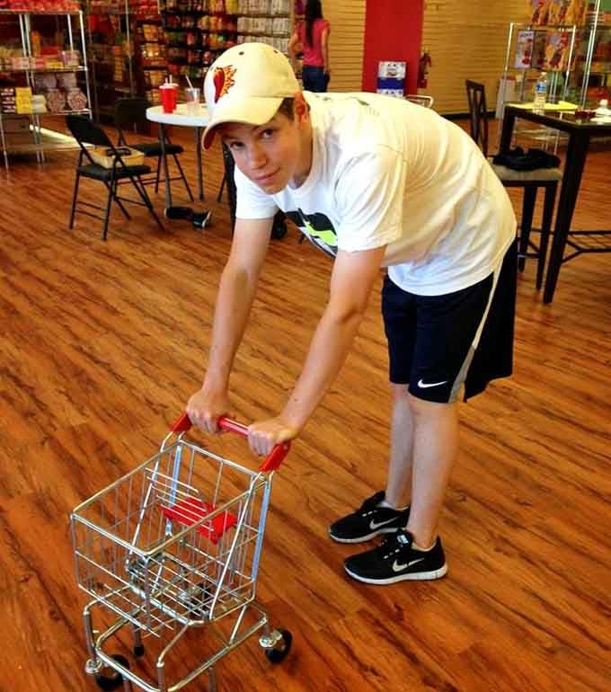 That miniature shopping cart is adorable, but let's be honest, you're going to need something much bigger here.