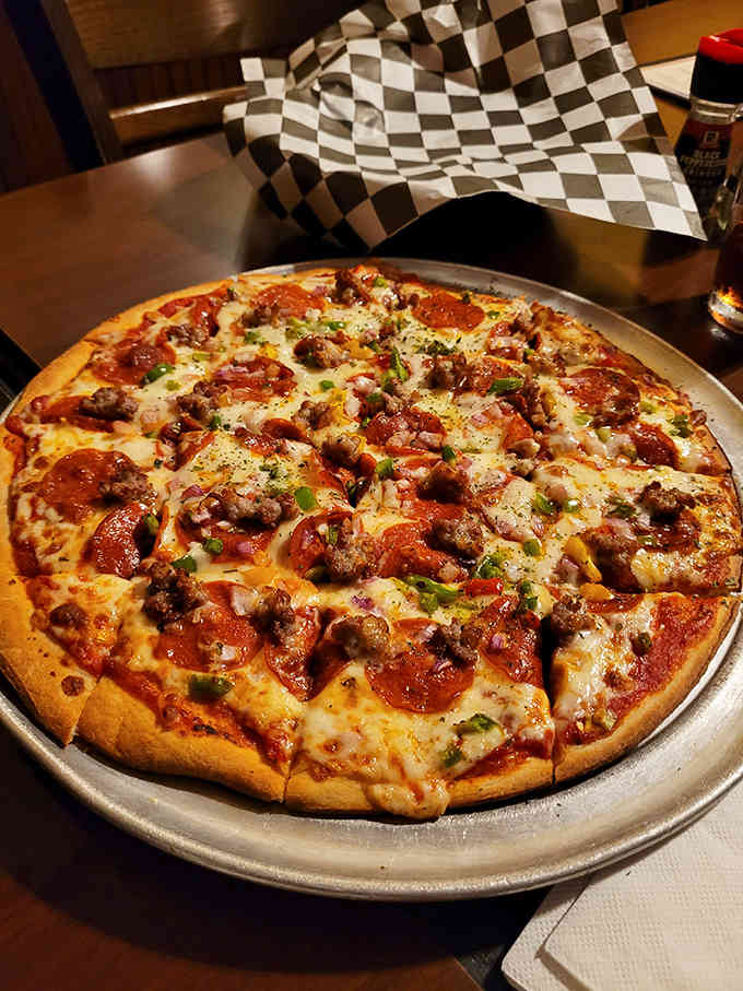 Thin crust loaded with pepperoni, sausage, and green peppers proves that pizza perfection hasn't changed since the Depression era.