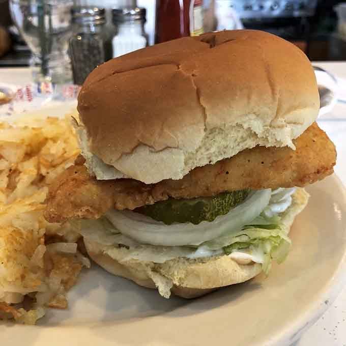The chicken filet sandwich comes loaded with pickles and onions, proving simple done right beats fancy every time.