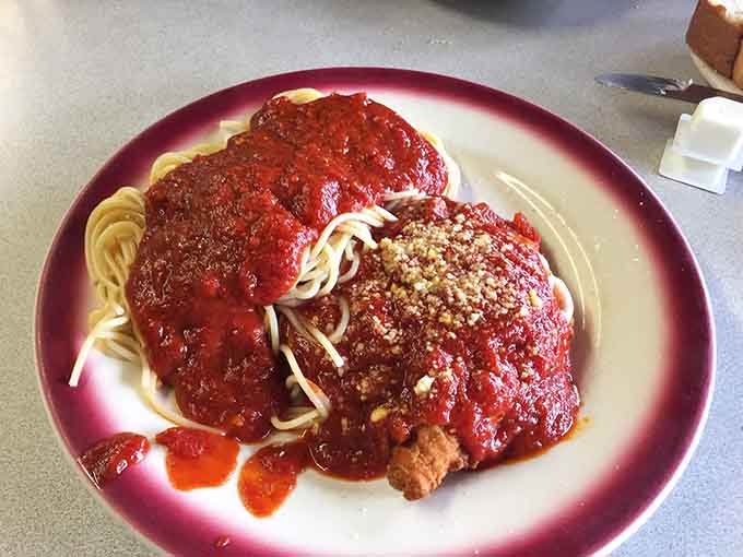 Spaghetti and meatballs topped with chicken cutlet because sometimes more really is more, gloriously so.