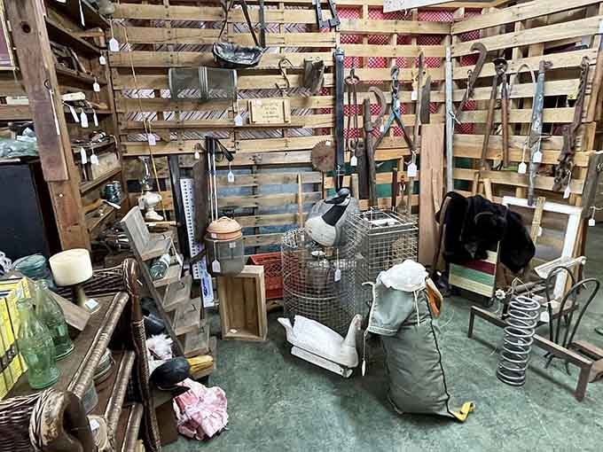 Rustic farm tools hanging like an agricultural museum dedicated to when things were built to last.