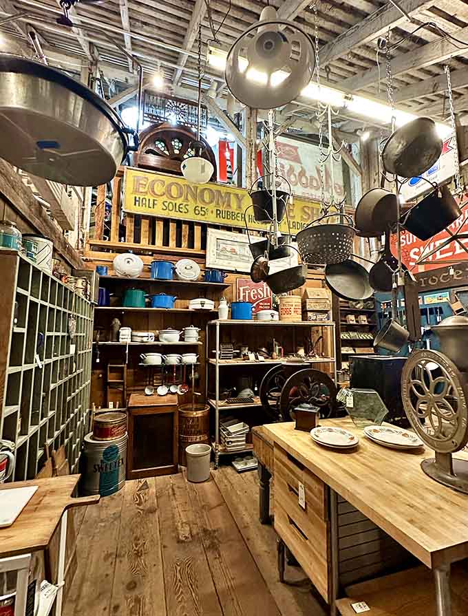 Hanging cookware creates a symphony of vintage kitchen charm, each piece ready to tell stories of meals long past.