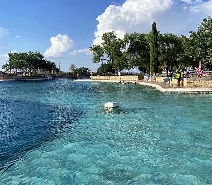 Crystal-clear water so inviting, you'll forget you're surrounded by desert until you look up at those mountains.