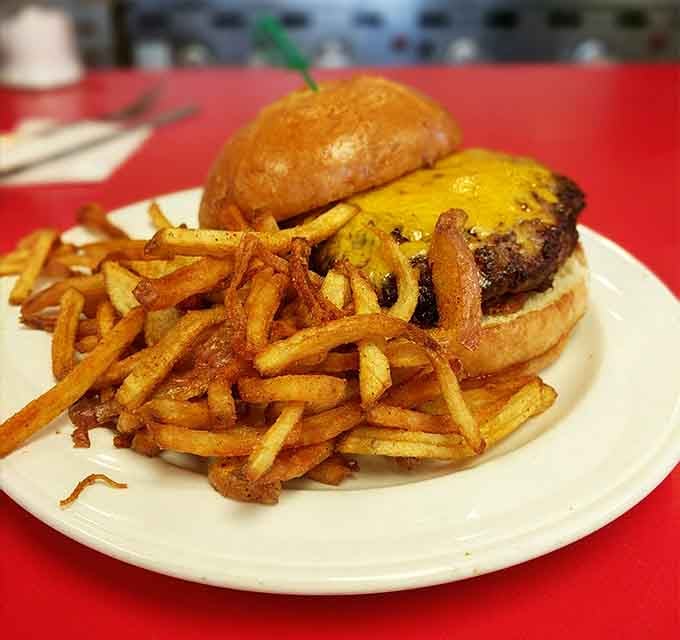 The Dude Ranch Burger comes with onion rings on top because sometimes more really is more.