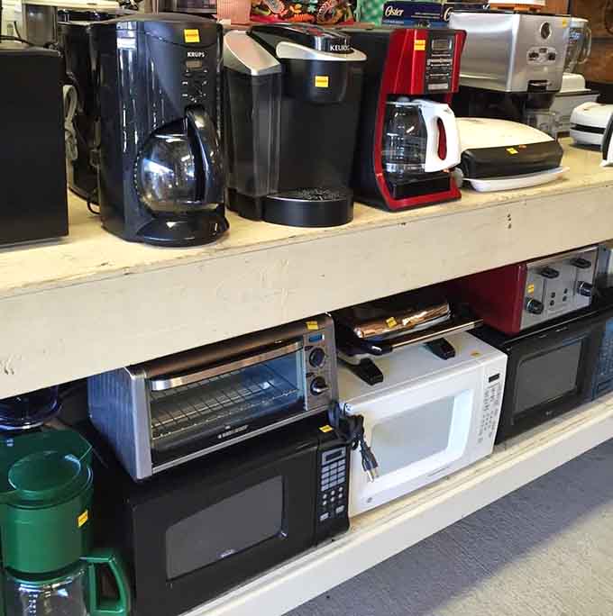 Coffee makers lined up like caffeinated soldiers ready to brew your morning salvation at bargain prices.