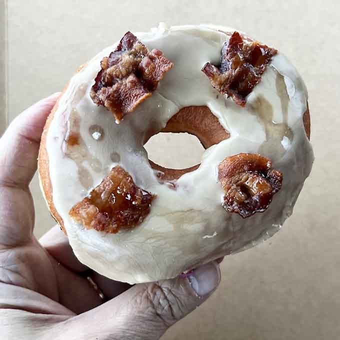 Maple bacon on a glazed donut: the sweet-savory combo that makes breakfast worth waking up for.