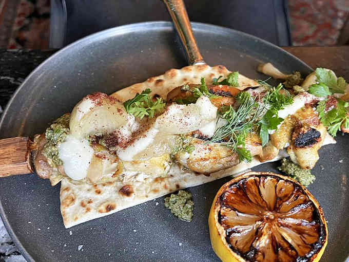 Chicken Musakhan arrives looking like it just won a beauty pageant for poultry, complete with herbs and a charred lemon crown.