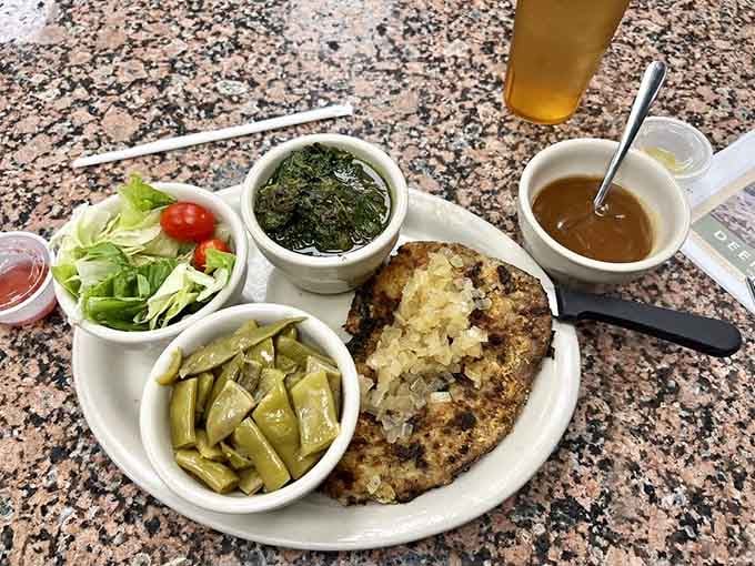 Grilled liver and onions with all the fixings proves that classic comfort food never goes out of style, ever.