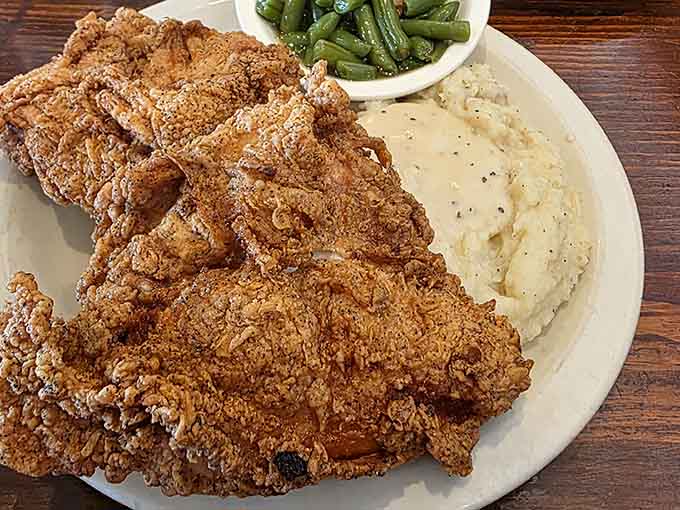 Crispy, golden fried chicken that would make the Colonel himself weep with envy, served with sides that actually matter.