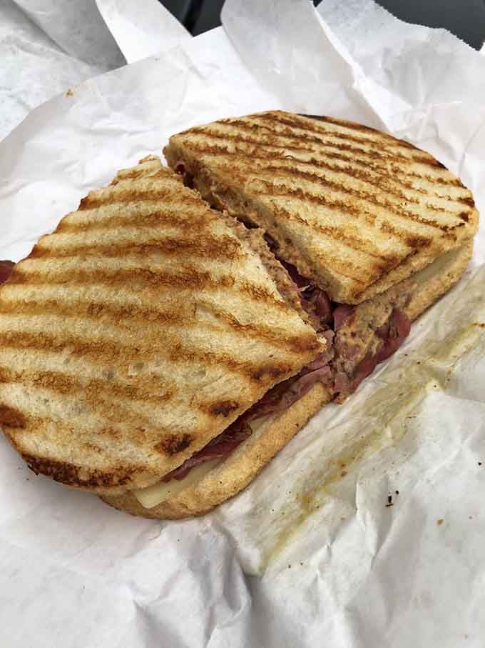 When pastrami gets piled this high on a sesame seed roll, you know someone in that kitchen truly understands abundance.